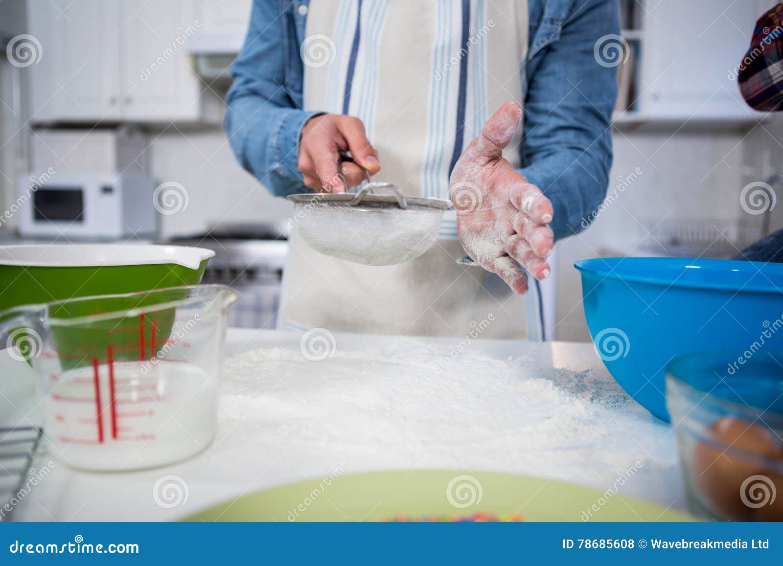 Man Sifting Flour through a Sieve Stock Photo - Image of leisure, adult ...