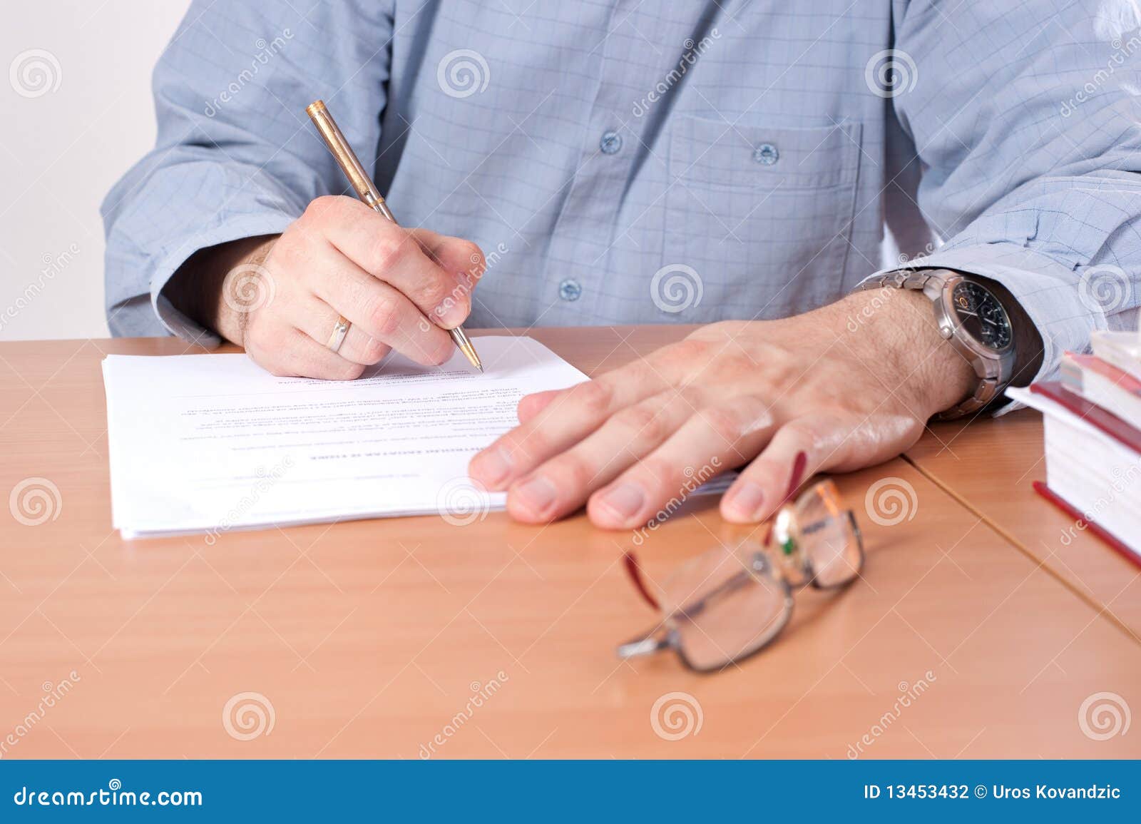 Man Signing Papers and Contracts on the Table Stock Photo - Image of ...