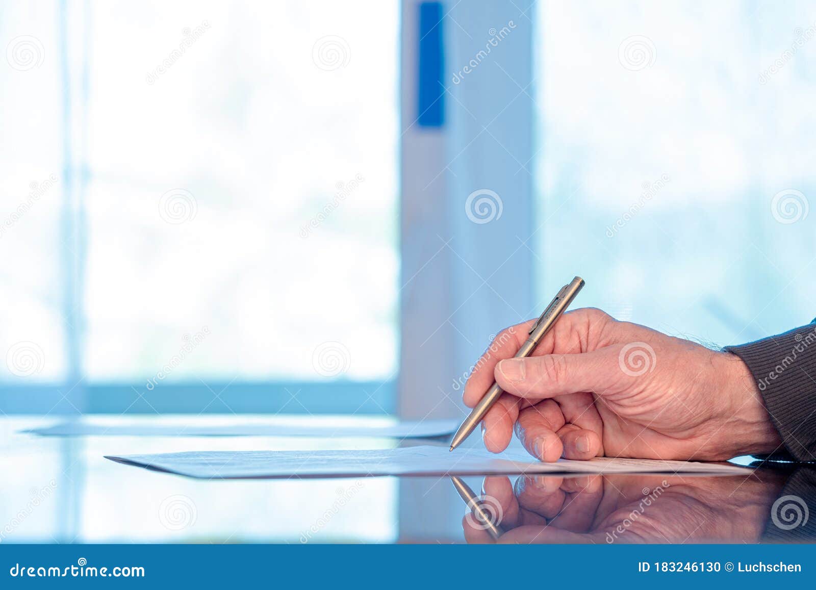 Man Signs a Document Form with a Ballpoint Pen in the Office Stock ...