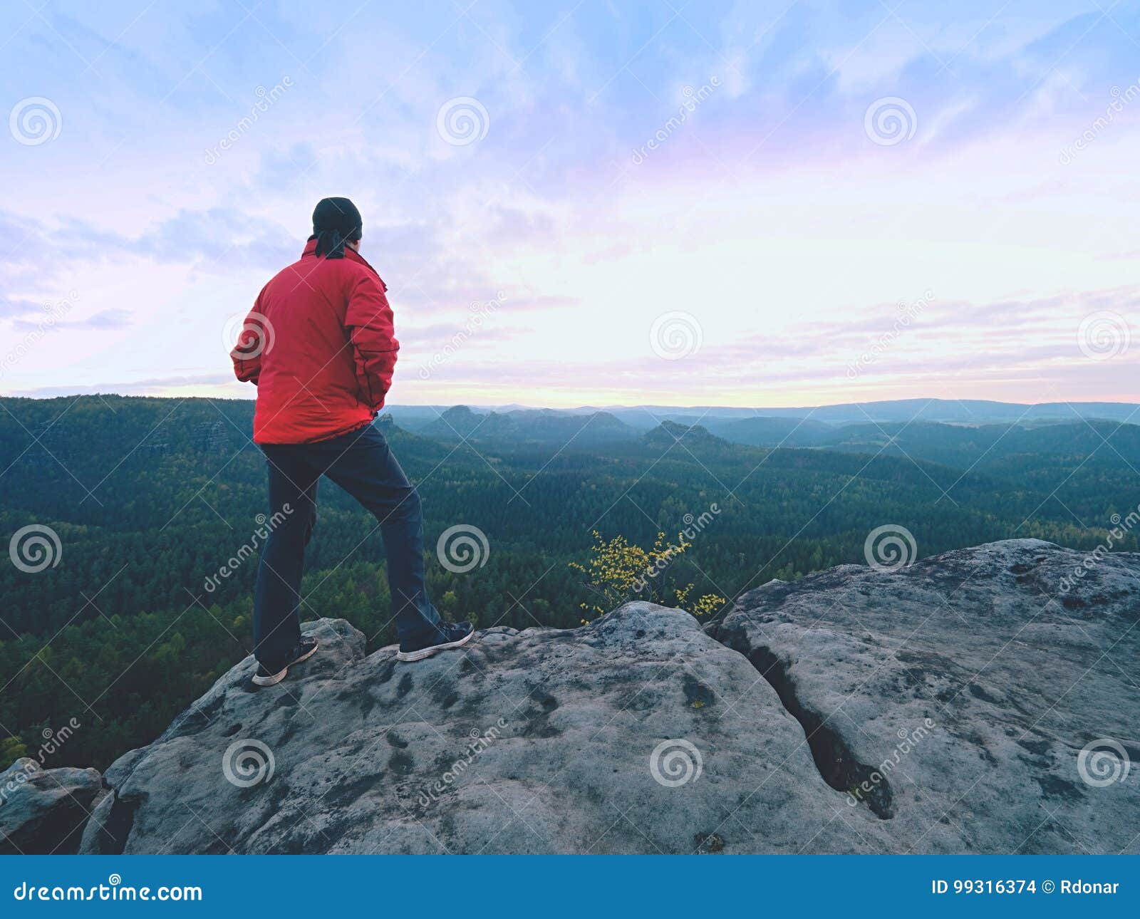 Man Silhouette on Cliff. Hiker in Red Jacket Climbed Up To Peak Enjoy ... Man Silhouette on Cliff. Hiker in Red Jacket Climbed Up To Peak Enjoy ...