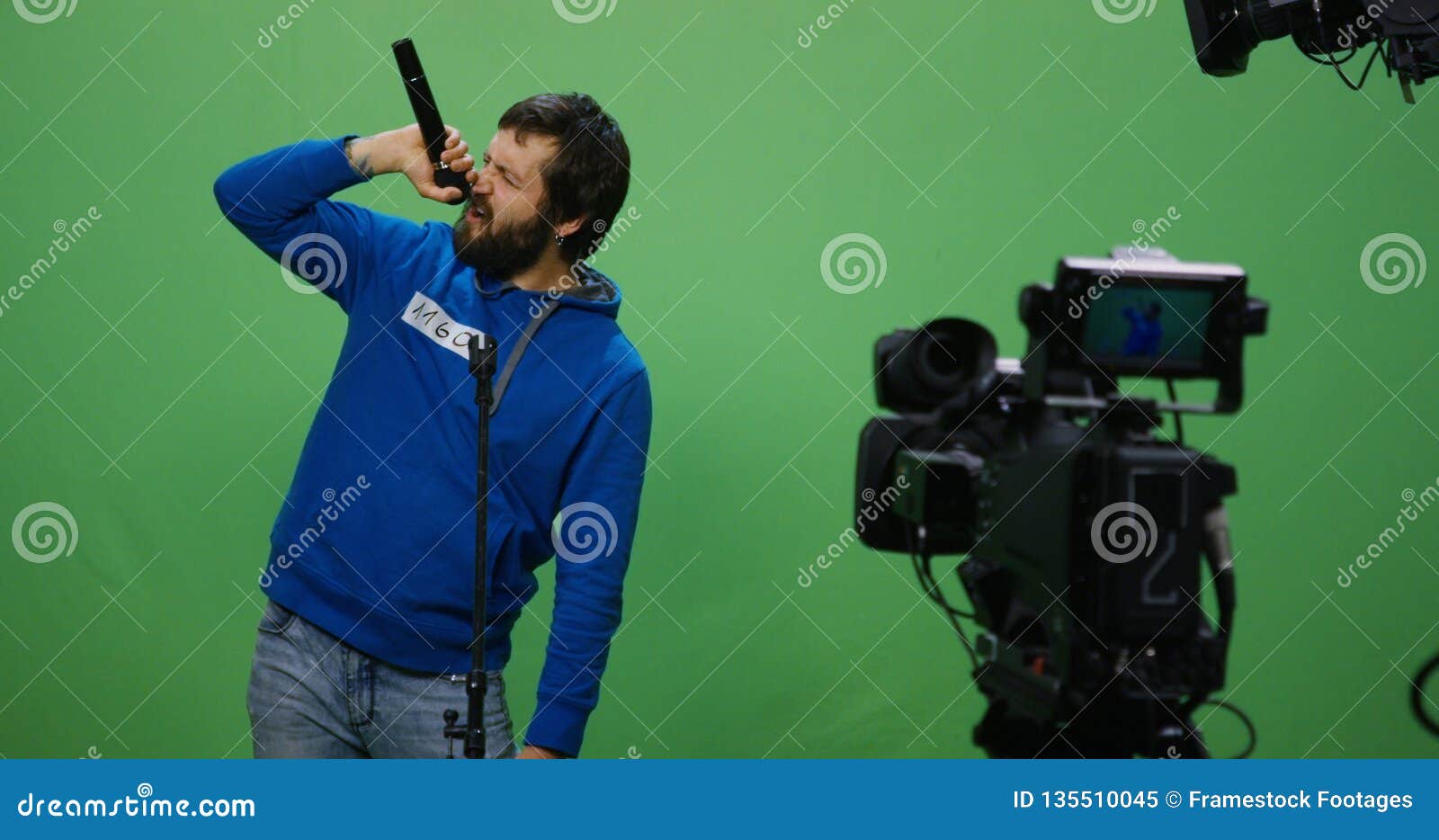 Man singing at an audition stock image. Image of indoors - 135510045