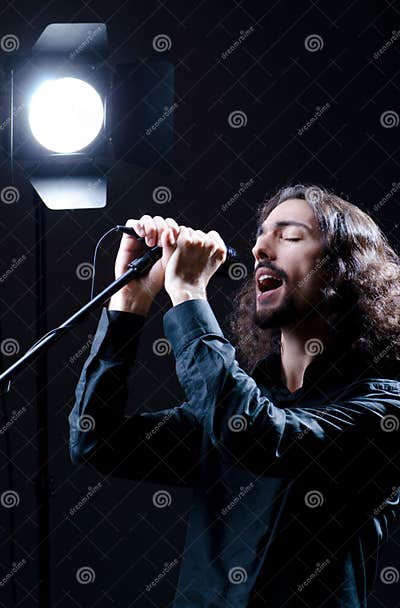 Man singing at the concert stock photo. Image of microphone - 23372584