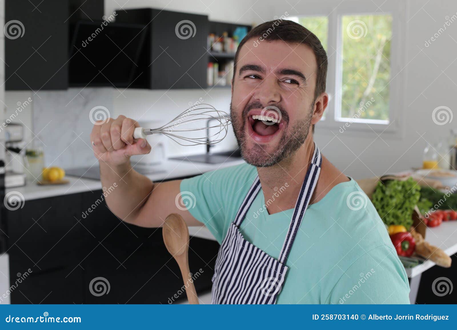 Man singing in the kitchen stock photo. Image of excited - 258703140