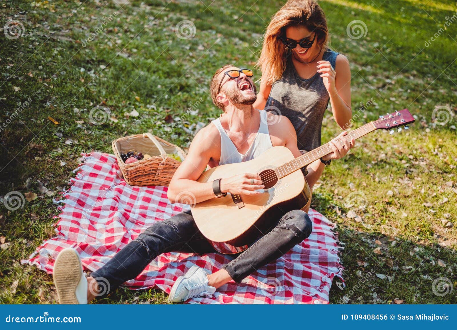 Man Singing To His Girlfriend on a Picnic Stock Photo - Image of ...