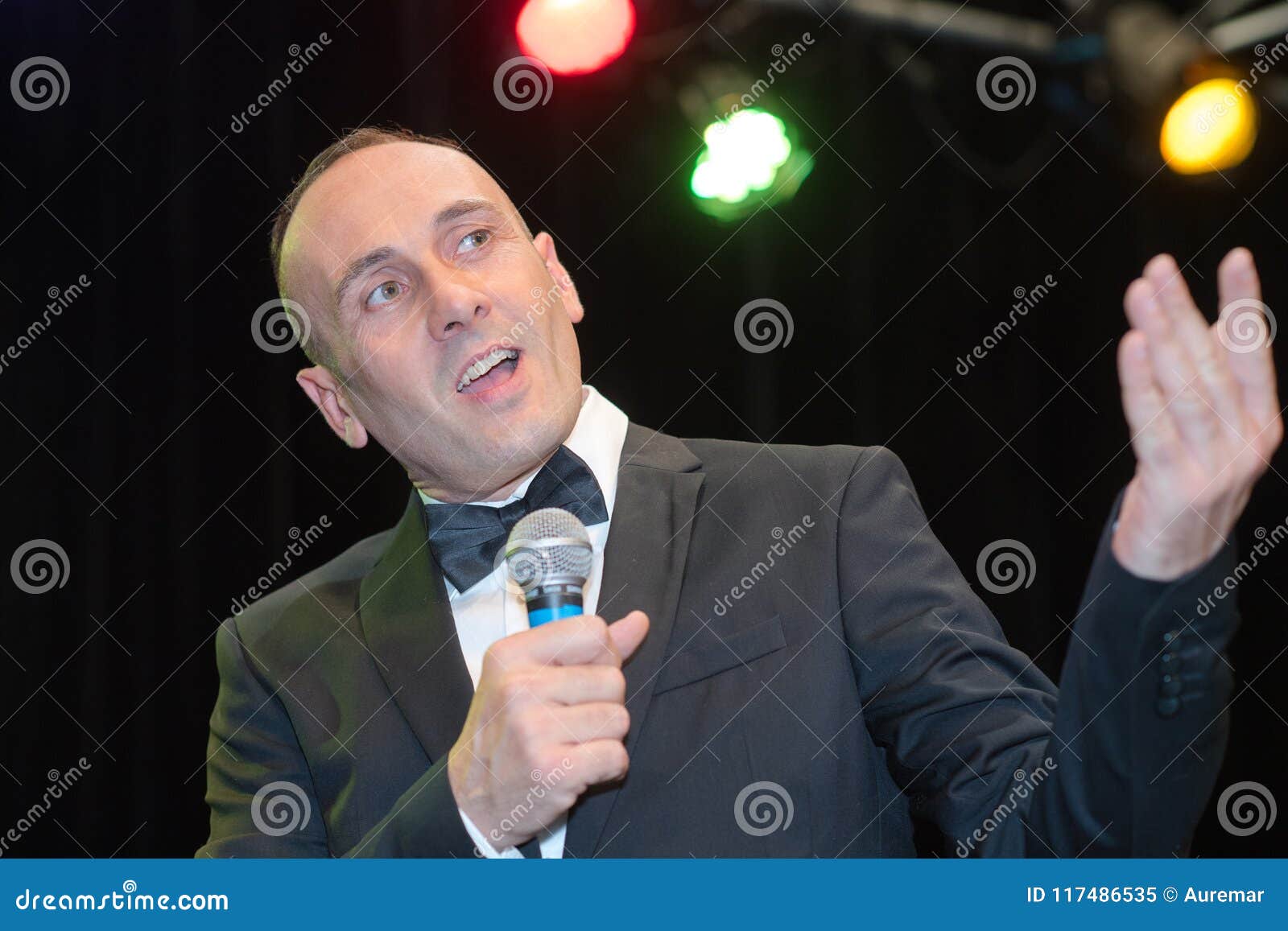 Man singing on stage stock image. Image of performer - 117486535
