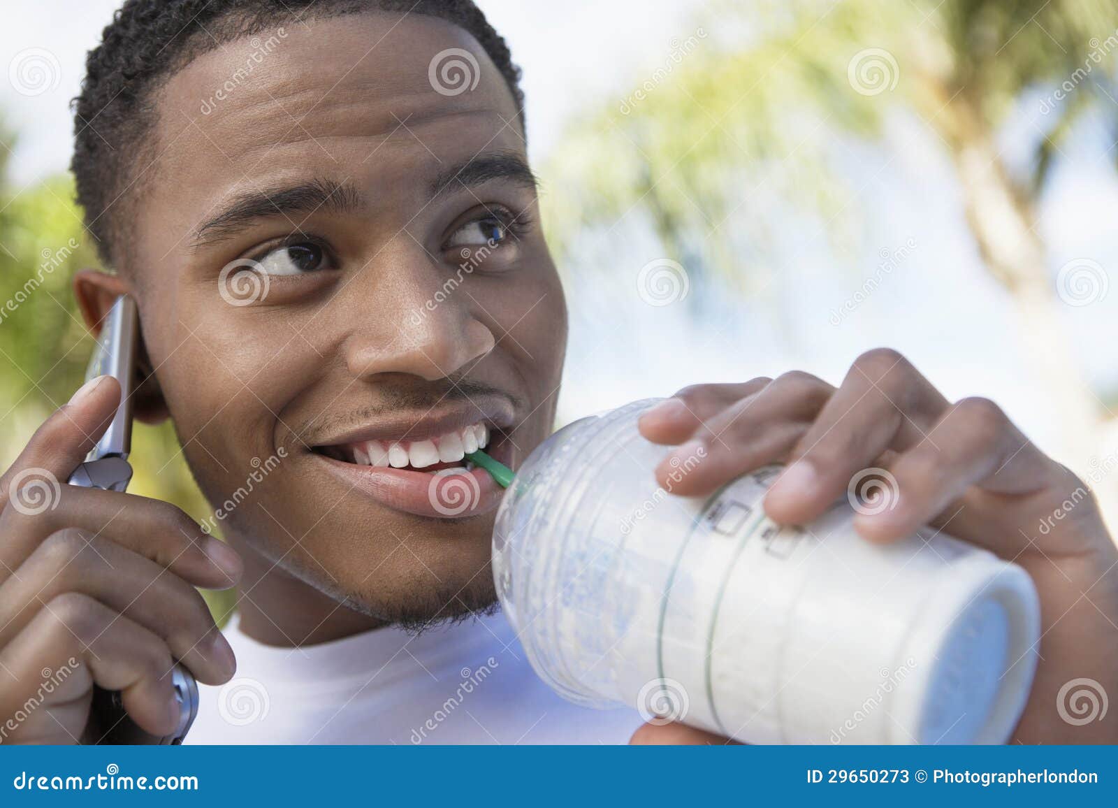 Man Sipping Milkshake while on Call Stock Image - Image of conversation ...