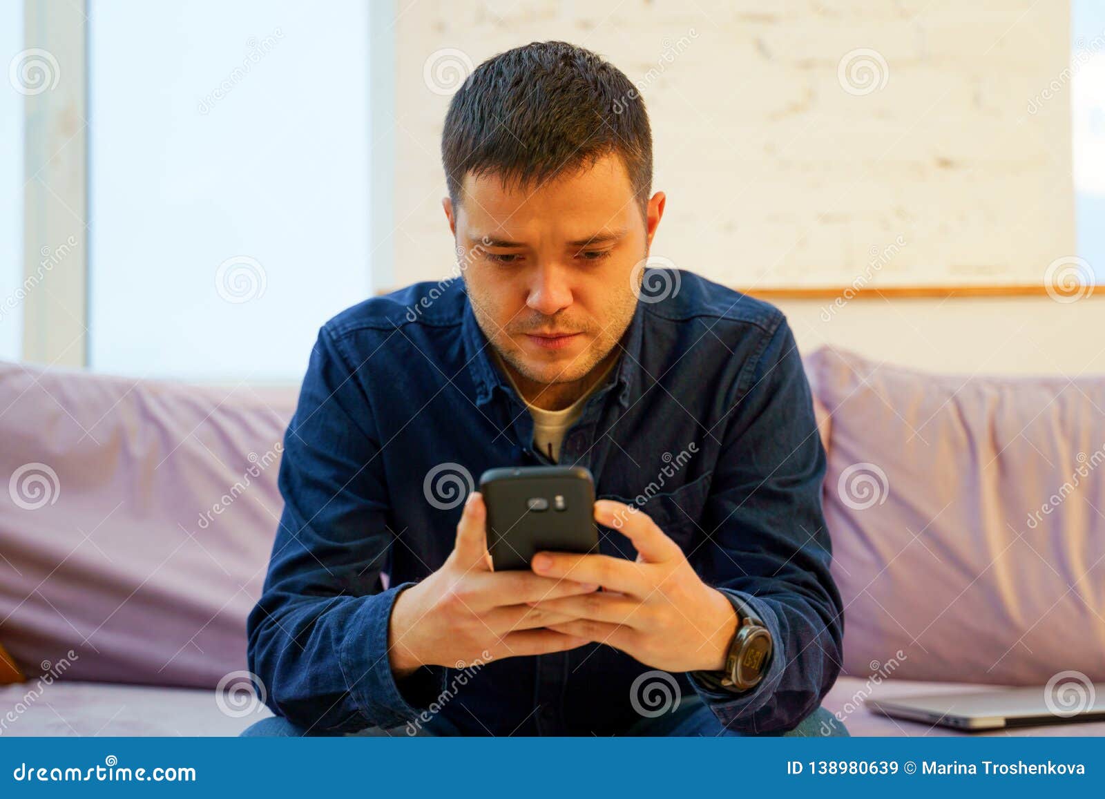Man Sit on the Couch and Using Smartphone Stock Image - Image of mobile ...
