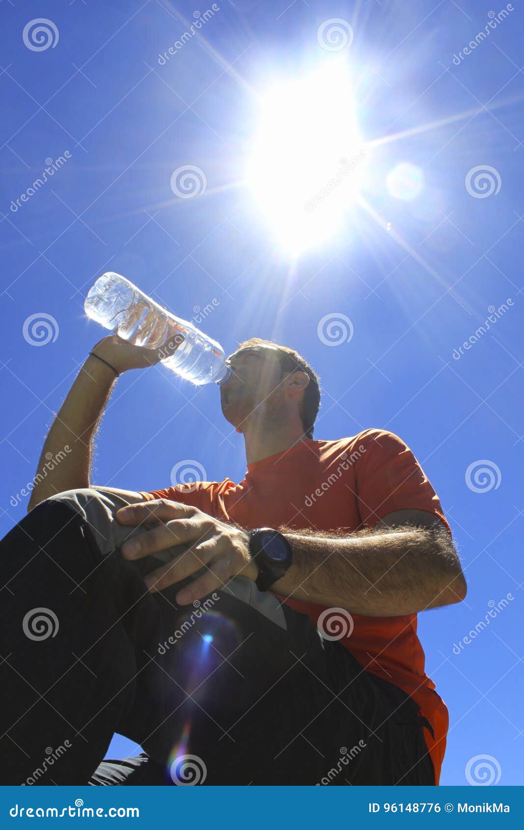 Man Sit Drinking Water with the Sun Stock Photo - Image of bottle ...
