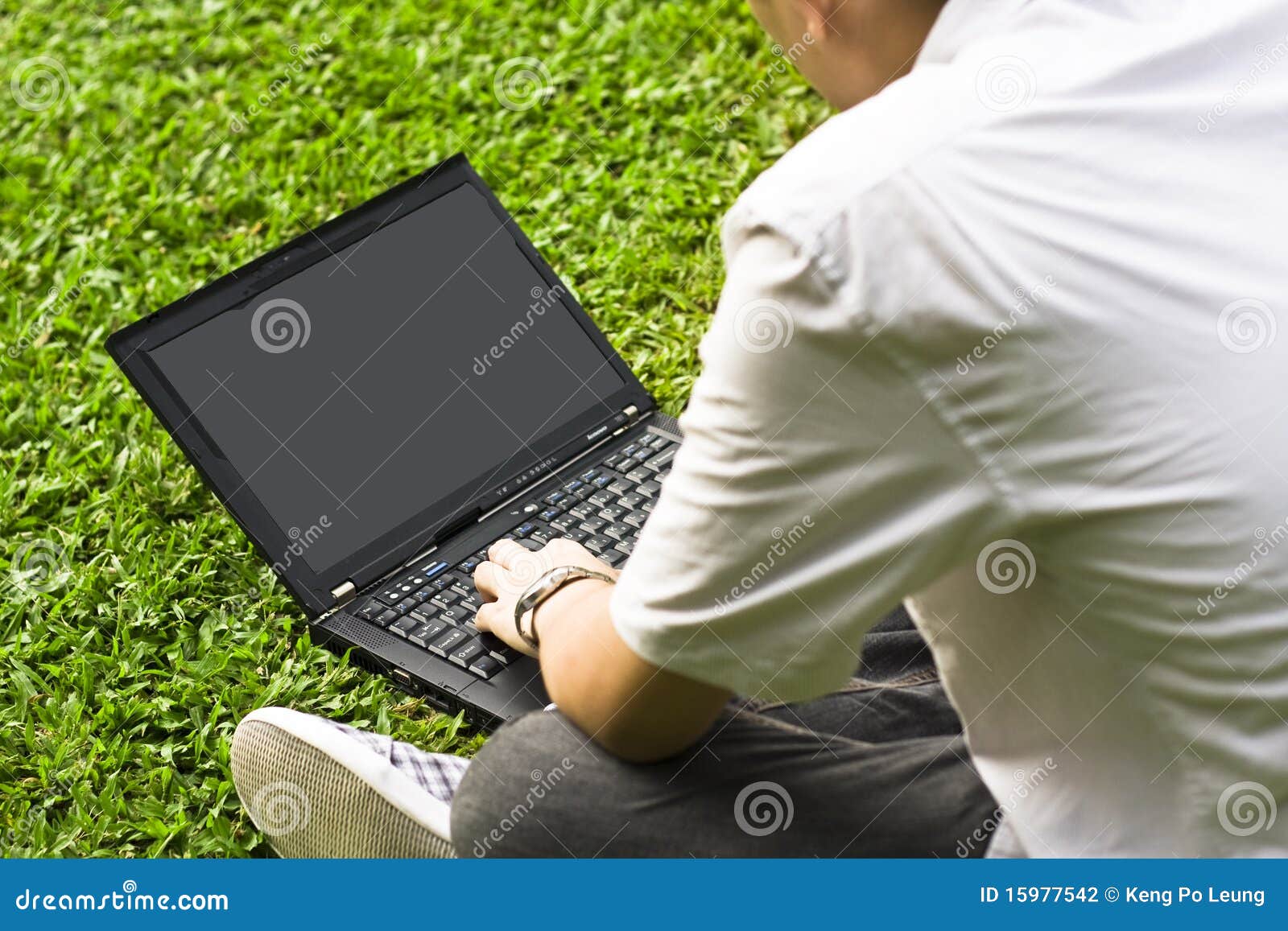 Man Siting on the Grass Using Laptop Stock Photo - Image of green ...