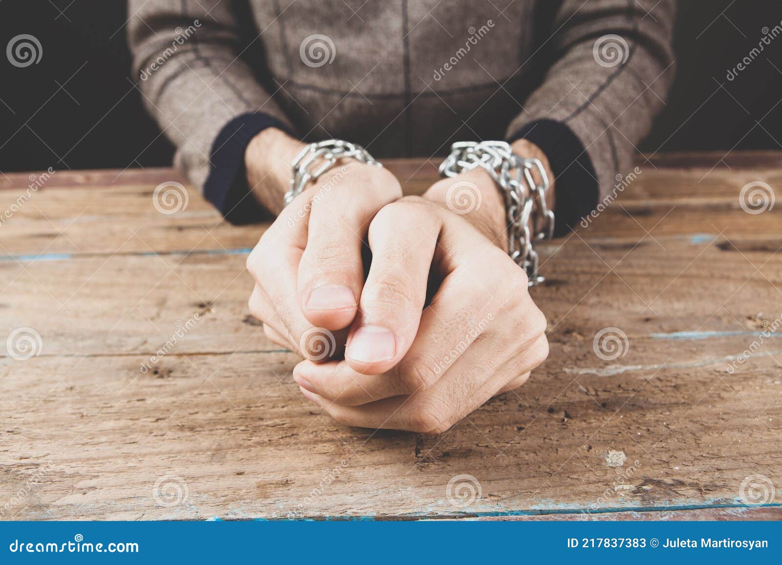 The Man Sits in Chains. Prisoner Concept Stock Image - Image of chains ...