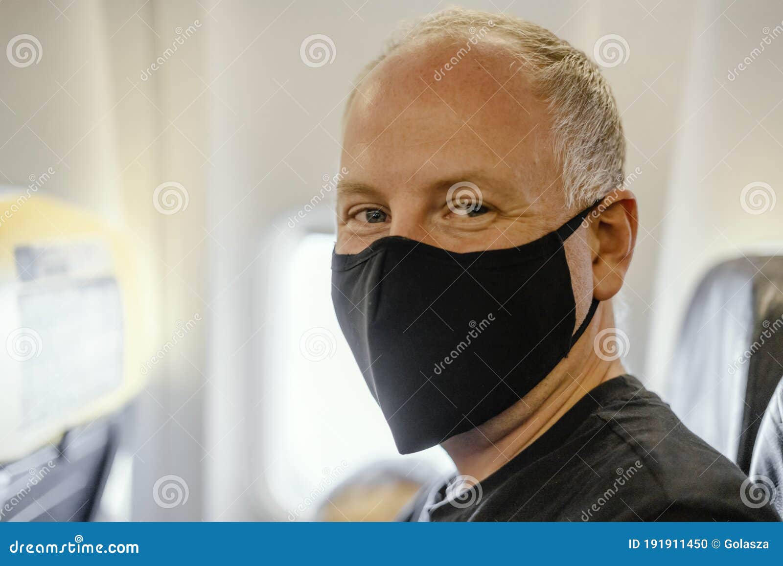 Man Sitting in the Airplane in Protective Face Mask Stock Photo - Image ...