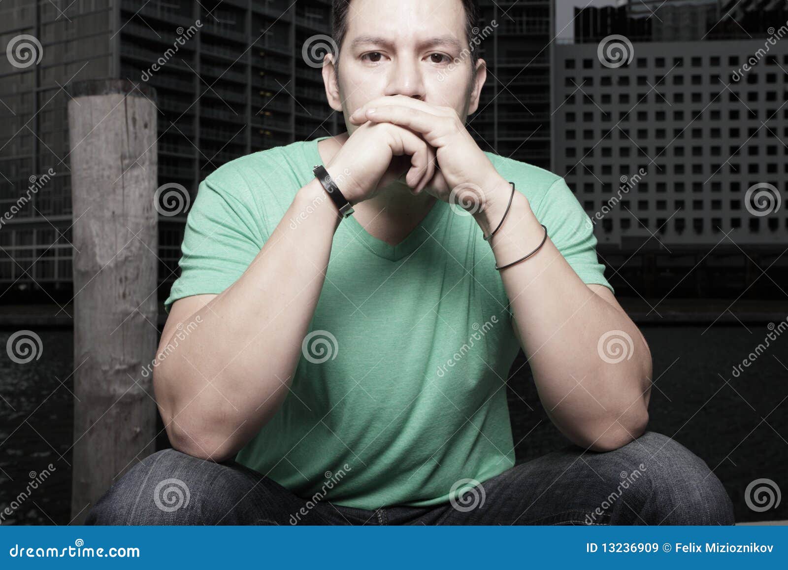Man Sitting Alone and Pondering Stock Image - Image of outdoors ...