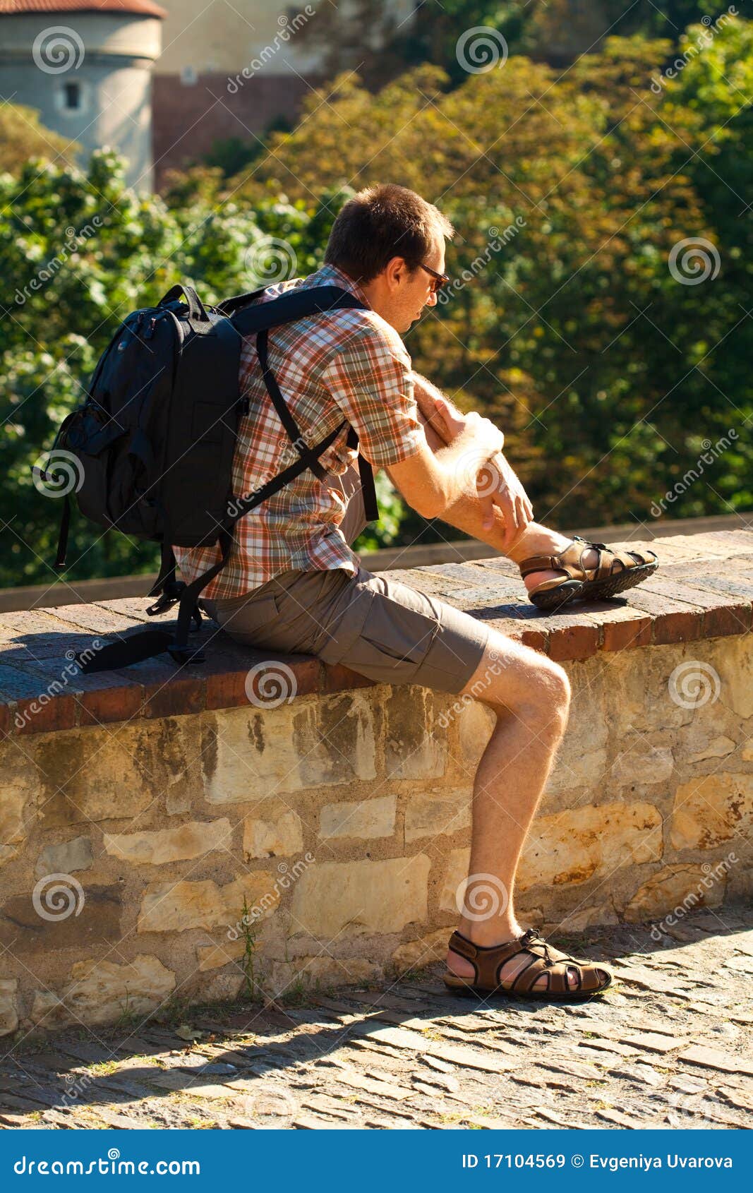 Man Sitting on a Background of Green Foliage Stock Image - Image of ...