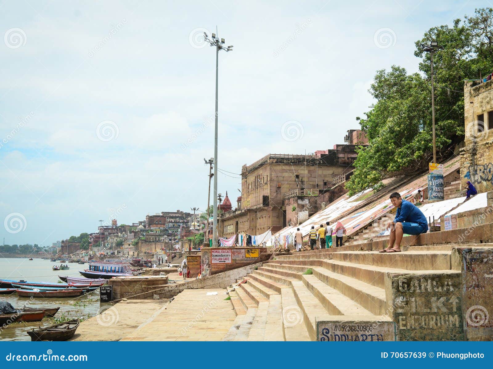 A Man Sitting on the Bank of Ganges River in Varanasi, India Editorial ...