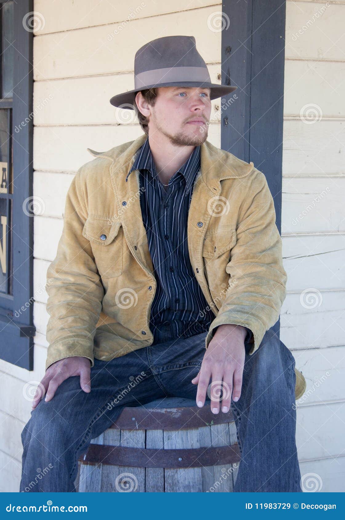 Man sitting on a barrel stock image. Image of serious - 11983729
