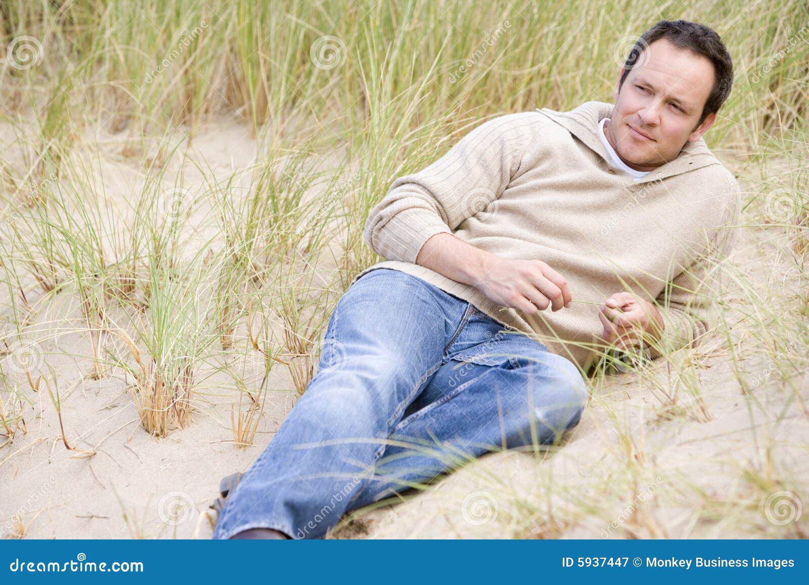 Man sitting on beach stock image. Image of caucasian, seaside - 5937447