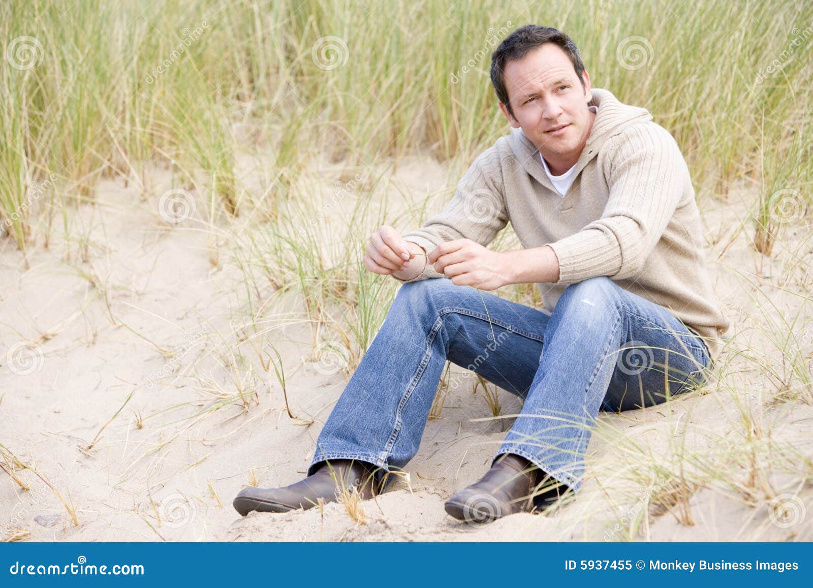 Man sitting on beach stock image. Image of relaxed, fall - 5937455