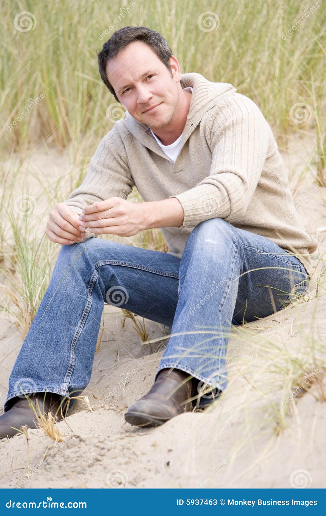 Man sitting on beach stock image. Image of offset, dunes - 5937463