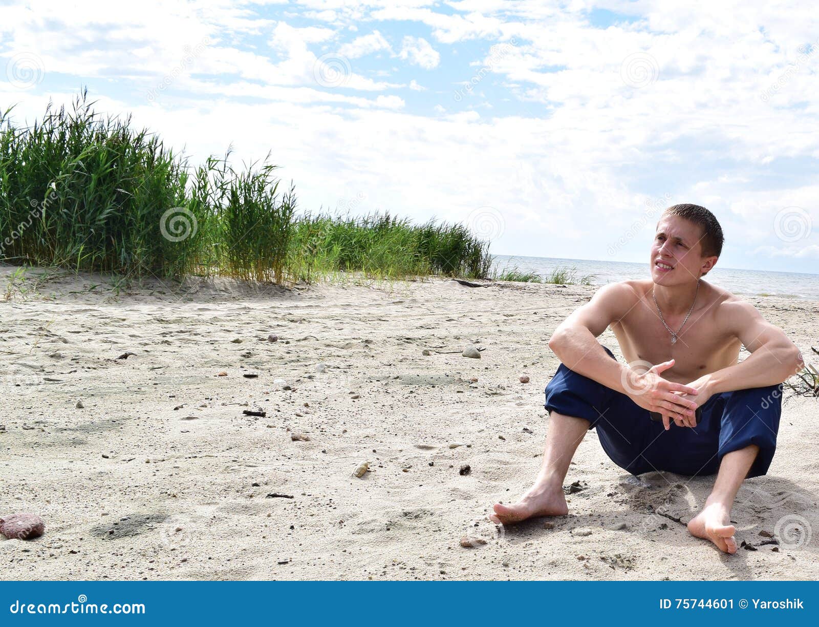 Man Sitting On The Beach Near The Sea Stock Image Image Of Park Lies