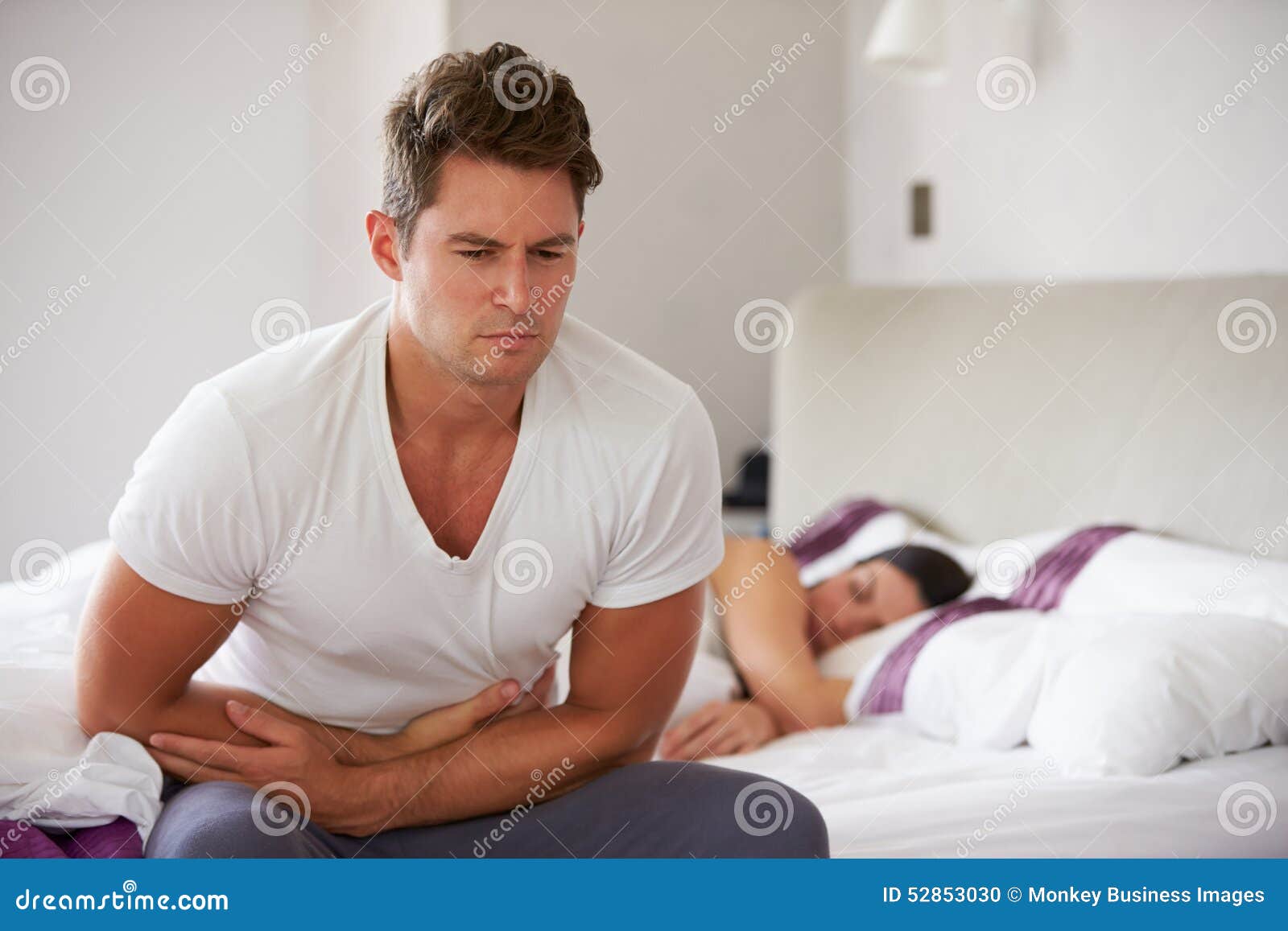 Man Sitting on Bed and Feeling Unwell Stock Photo - Image of together ...