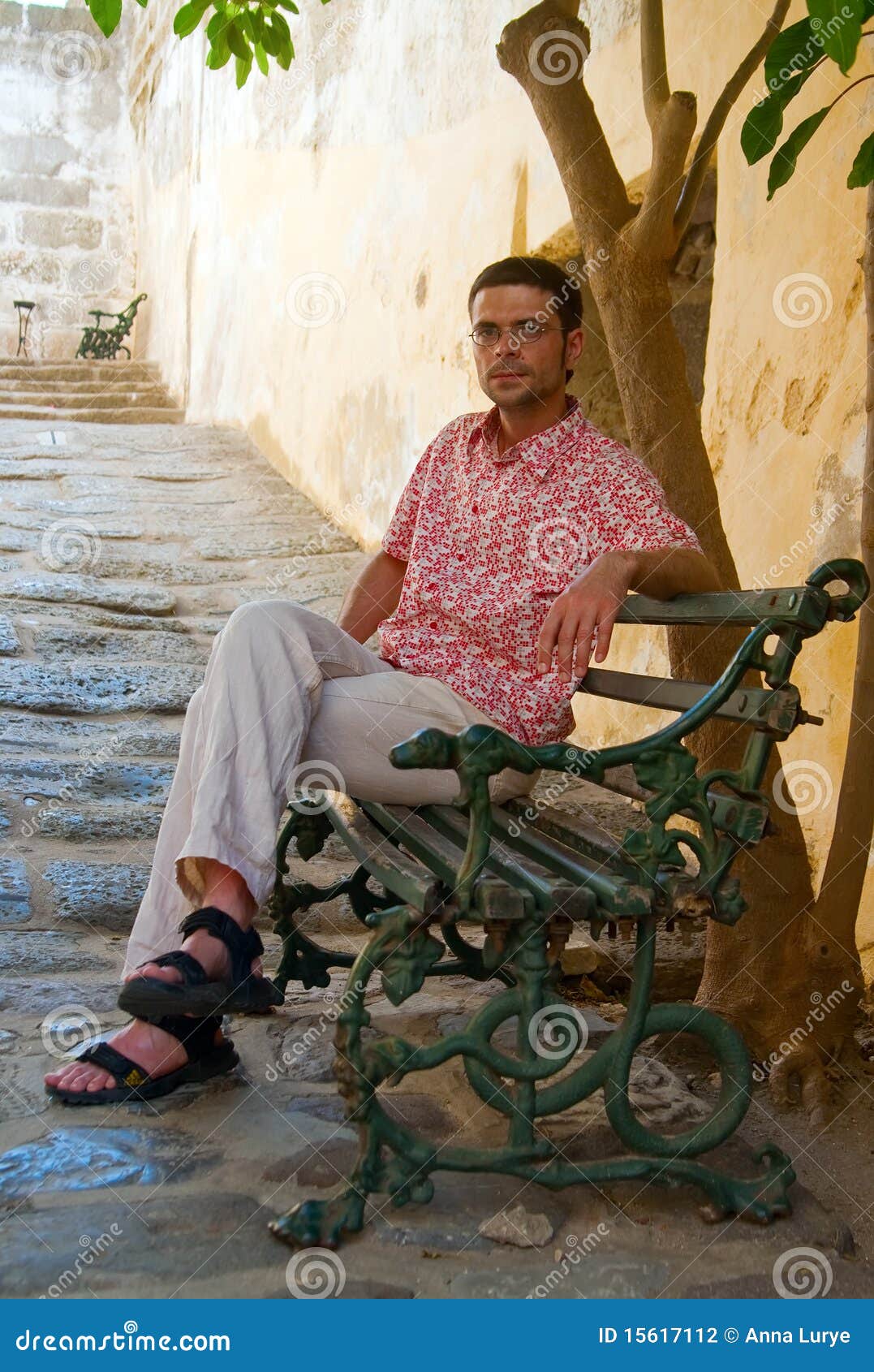 Man Sitting on a Bench stock photo. Image of fashioned - 15617112