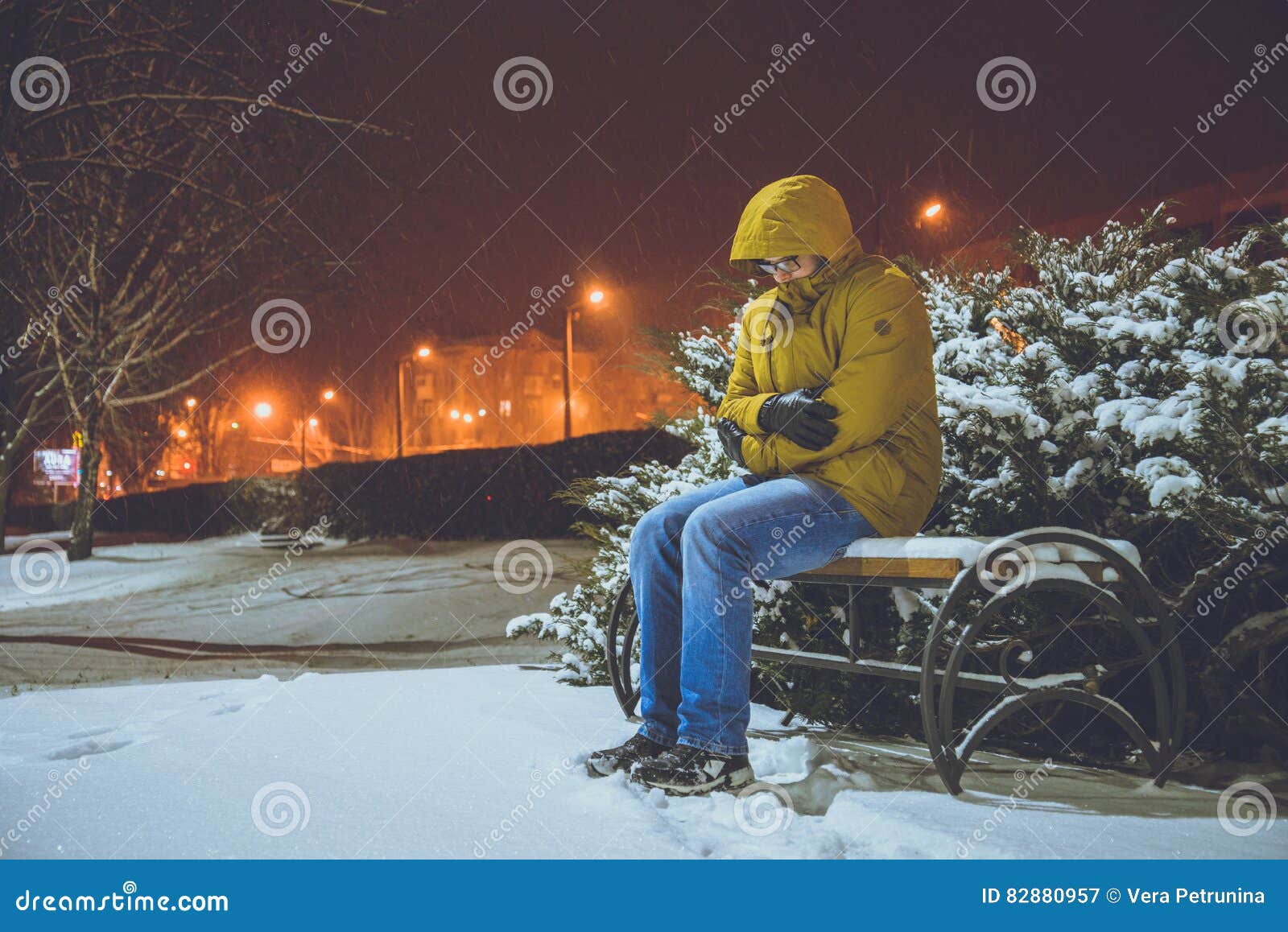 Man Sitting on a Bench in Cold Winter Night Stock Image - Image of ...