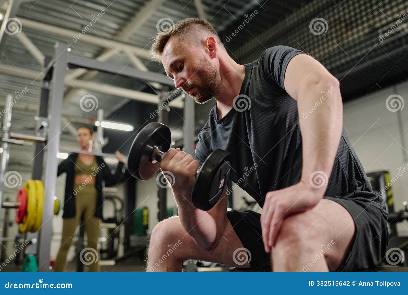 Man Sitting on Bench and Doing Exercise Stock Photo - Image of muscle ...