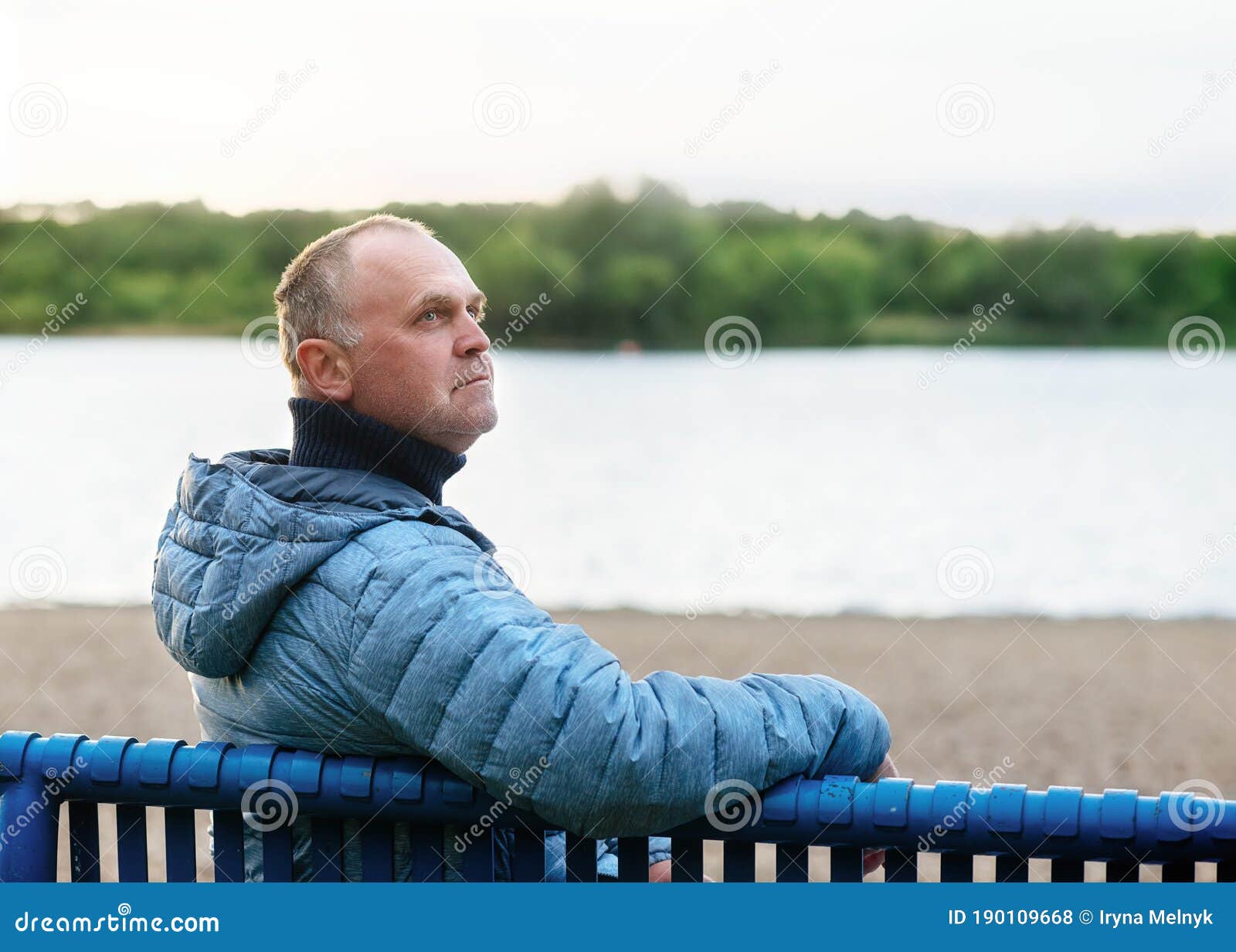 Man Sitting on Bench Near the Lake Stock Photo - Image of smile, relax ...