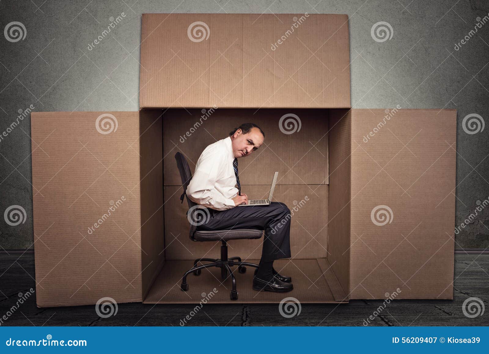 Man Sitting in a Box Working on Laptop Stock Image - Image of packed ...
