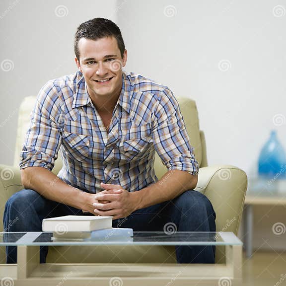 Man sitting in chair stock photo. Image of adult, face - 3523550