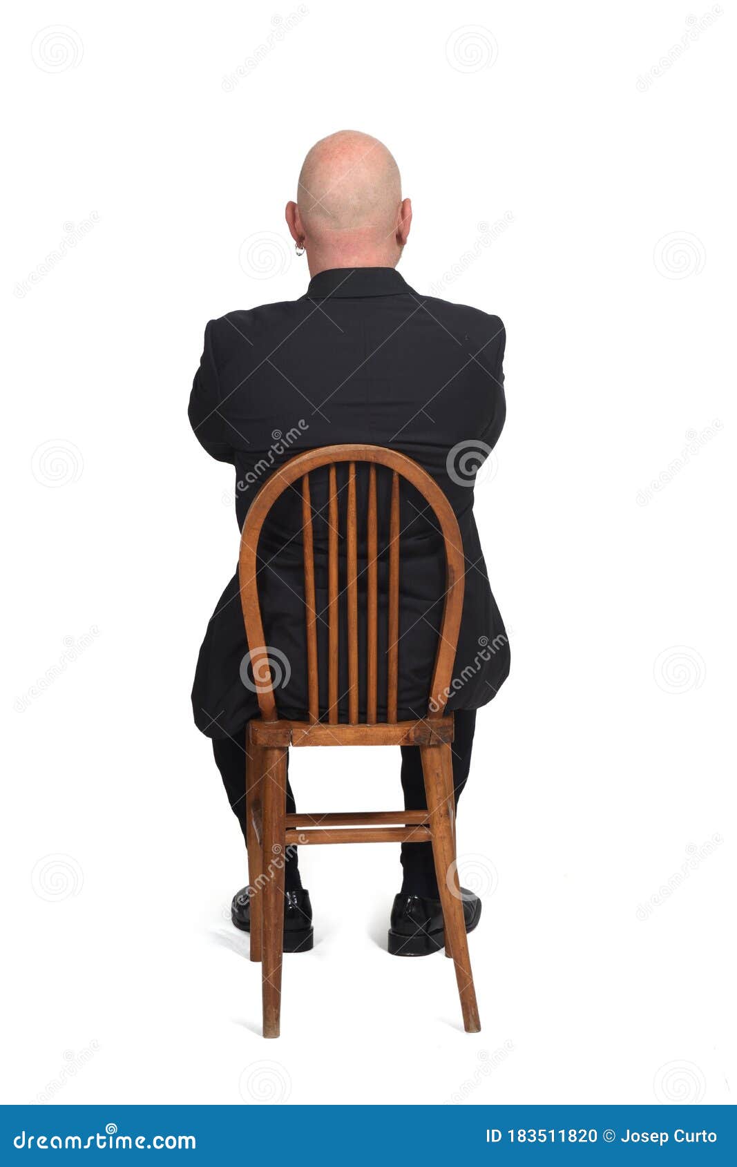 Man Sitting on a Chair with Her Back on White Background Stock Photo ...