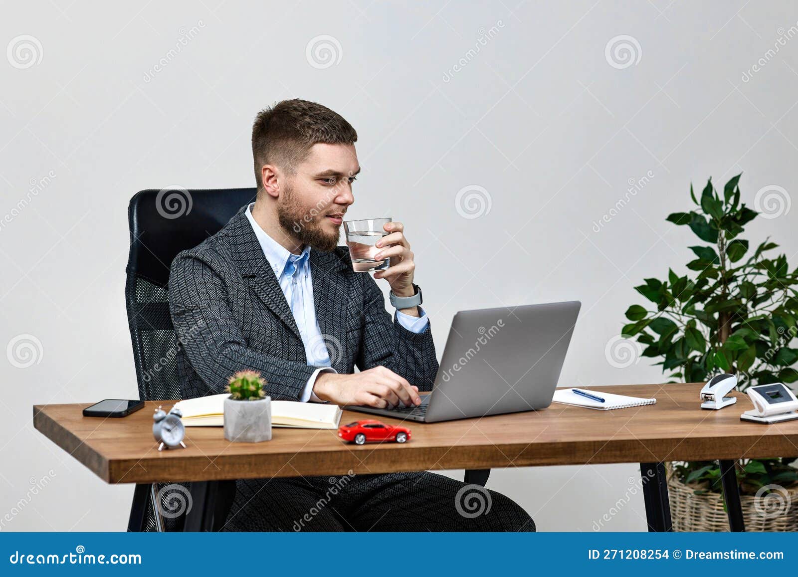 Man Sitting on Chair at Table and Resting, Using Laptop Stock Photo ...