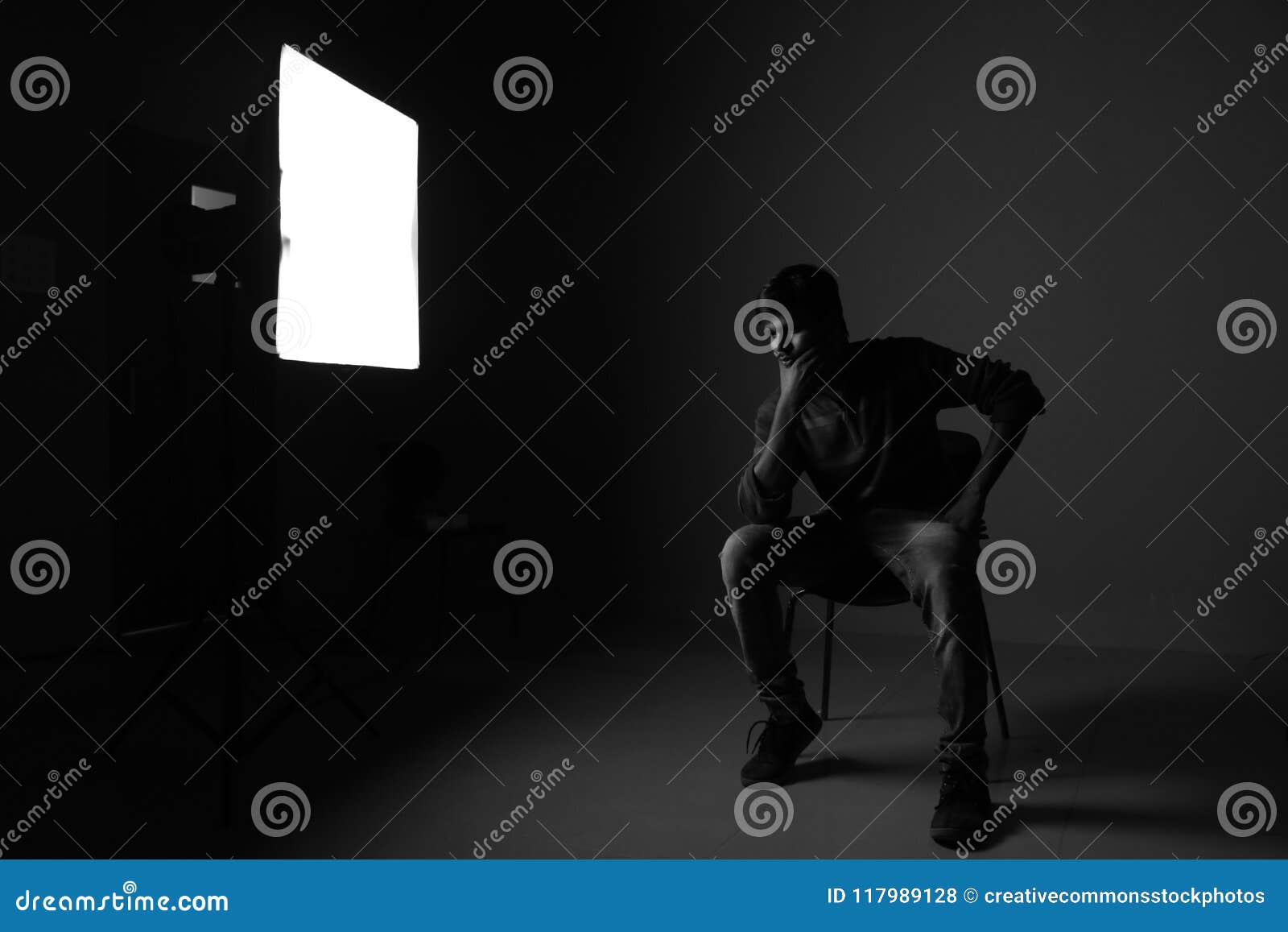 Man Sitting On Chair While Thinking Picture. Image: 117989128