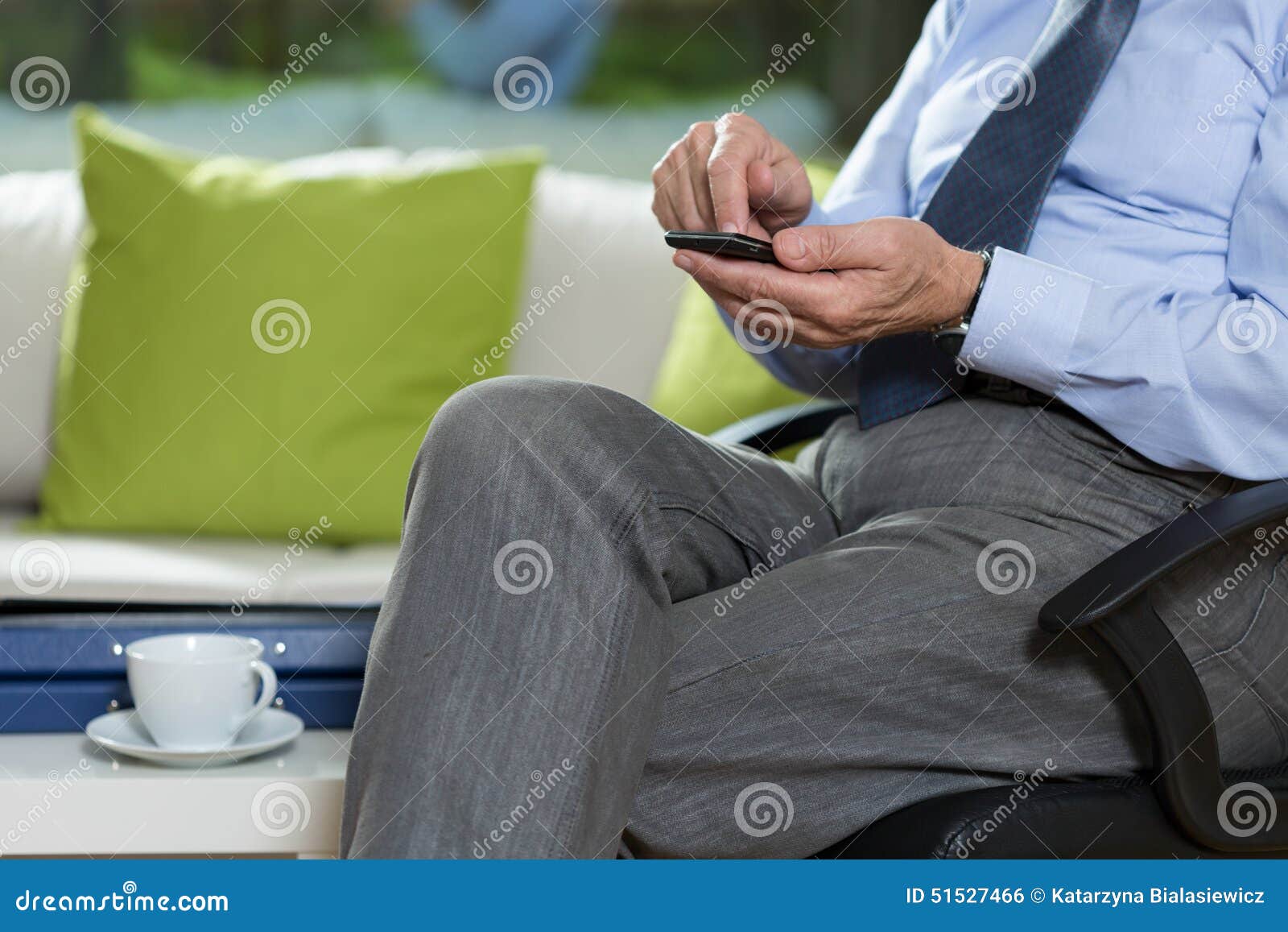 Man Sitting on Chair and Uses Phone Stock Photo - Image of modern ...