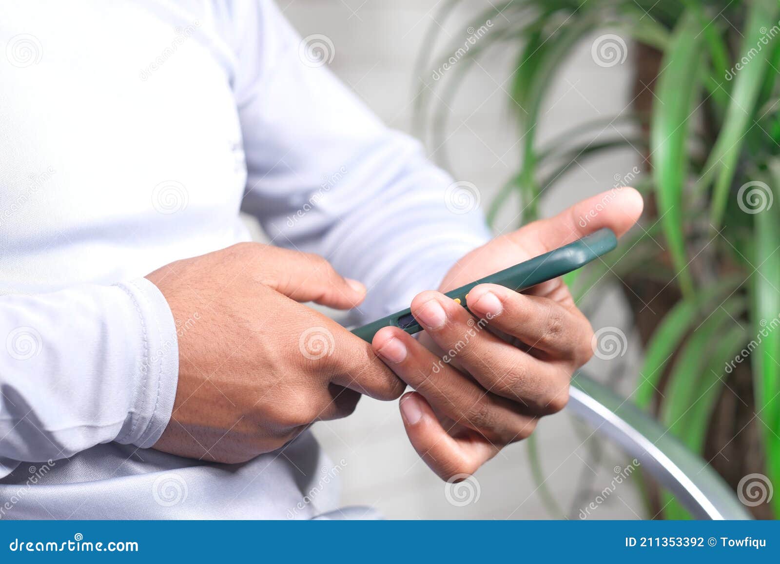 Man Sitting on a Chair Using Smart Phone Stock Photo - Image of call ...