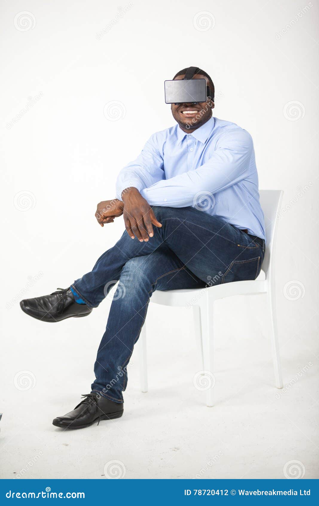 Man Sitting on Chair and Using Virtual Reality Headset Stock Photo ...