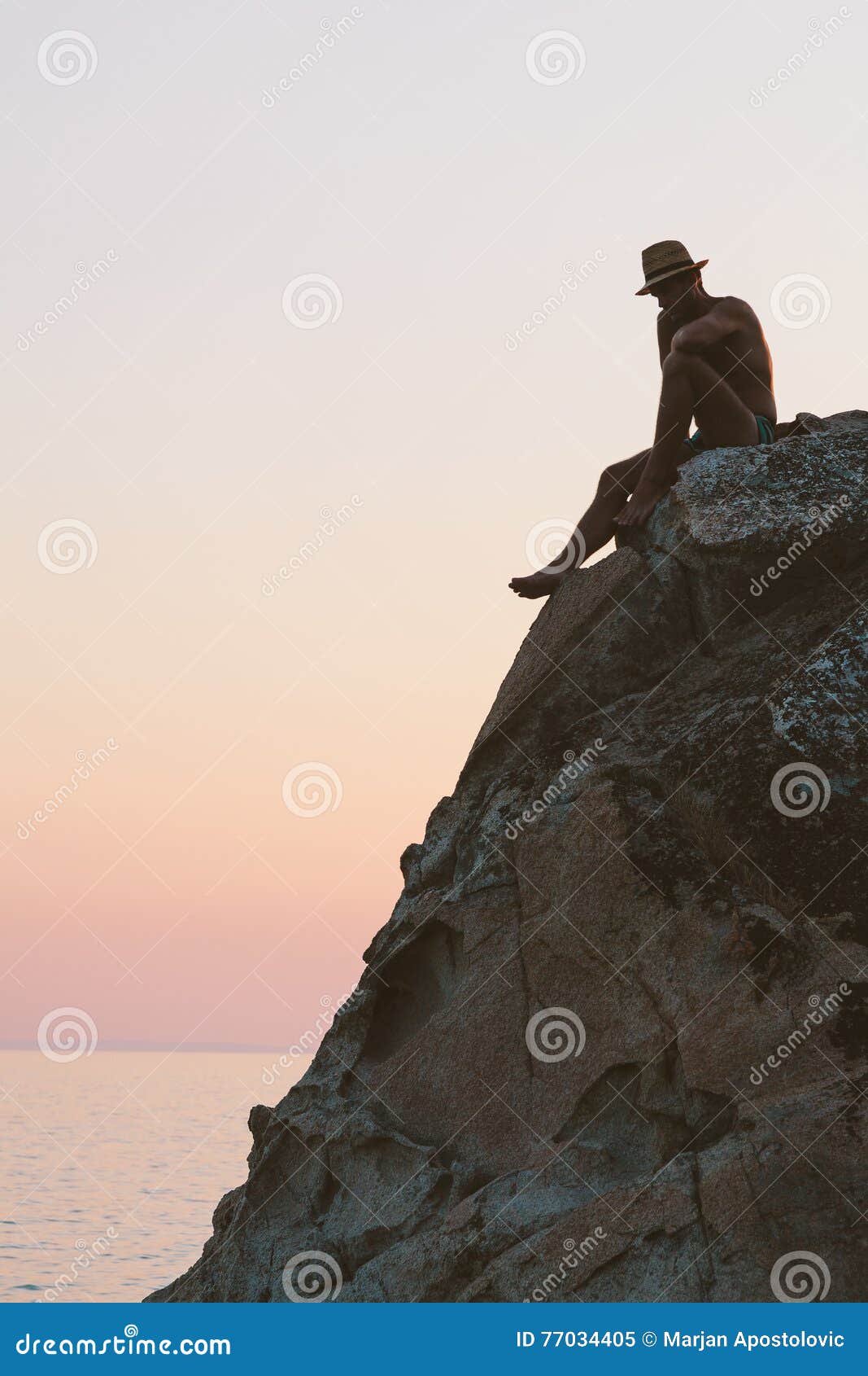 Man Sitting on Cliff Top on the Sunset Stock Image - Image of bright ...
