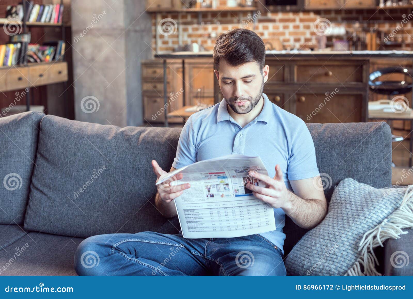 Man Sitting on Coach and Reading Newspaper Stock Photo - Image of ...