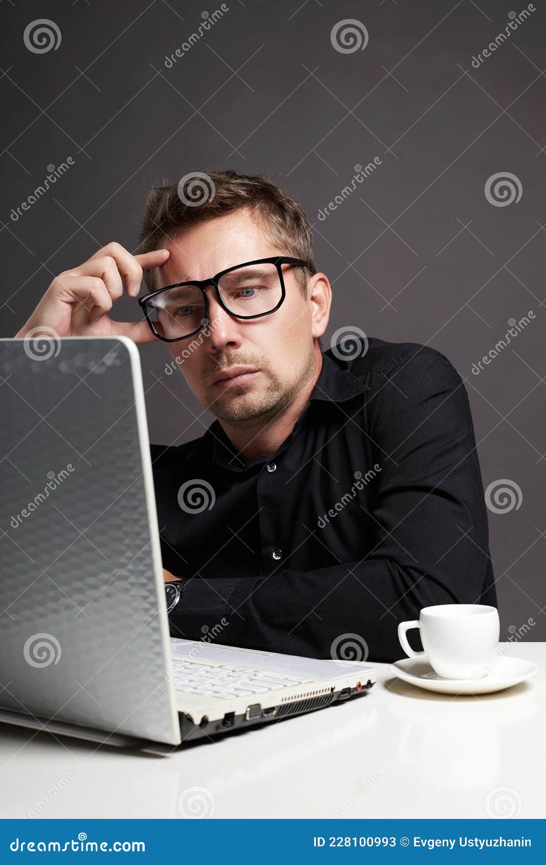Man Sitting at a Computer. Boy in Glasses Stock Image - Image of office ...