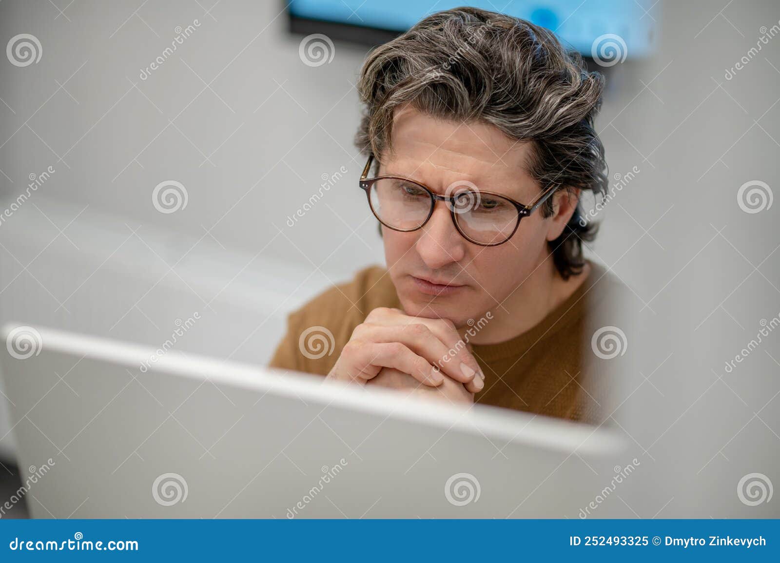 A Man Sitting at the Computer and Looking Concentrated Stock Image ...