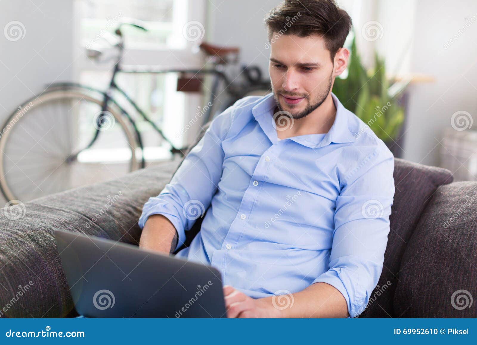 Man Sitting on Couch with Laptop Stock Photo - Image of adult, laptop ...