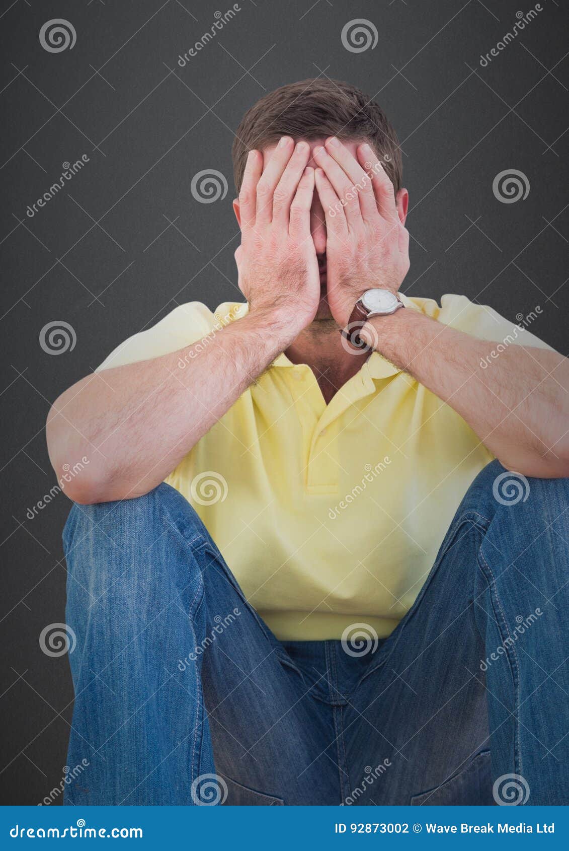 Man Sitting and Crying Against Grey Wall Stock Photo - Image of ...