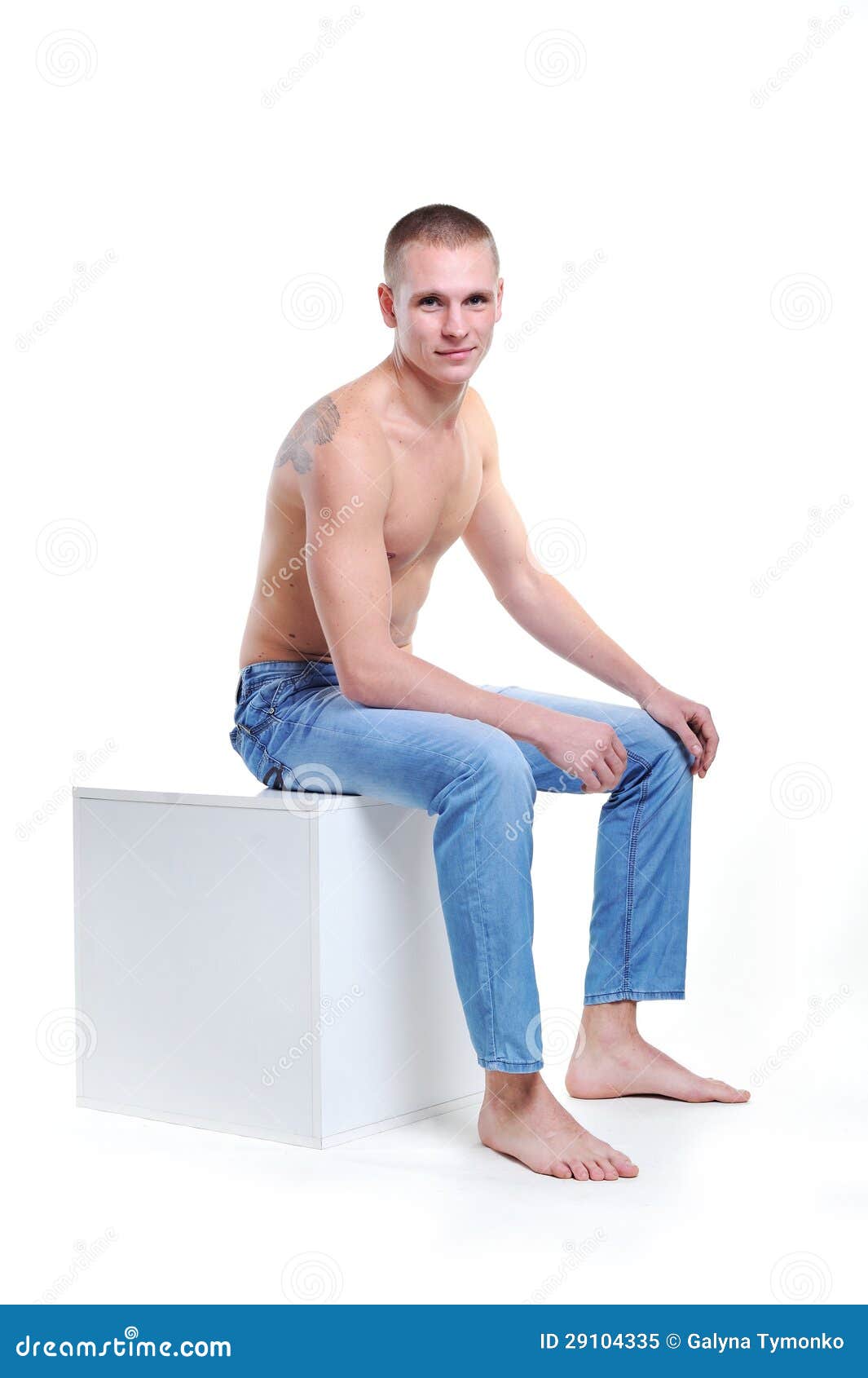 Man sitting on a cube stock image. Image of posing, background - 29104335
