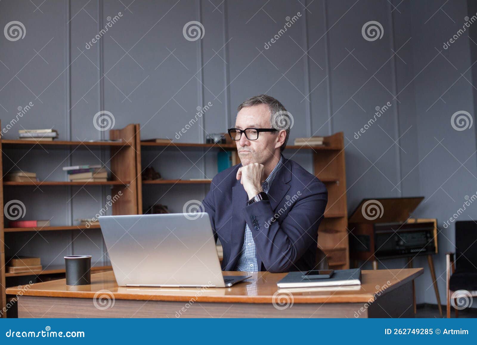 Man Sitting at a Desk and Looking into His Computer Stock Image - Image ...