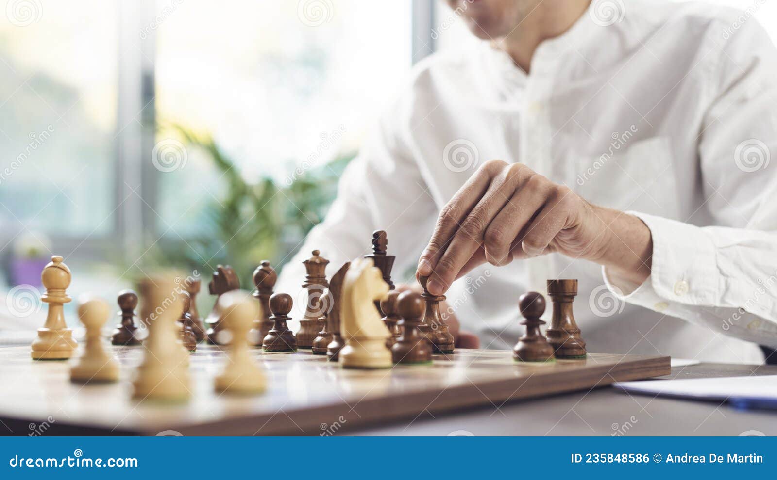 Man Sitting at Desk and Playing Chess Stock Photo - Image of focus ...