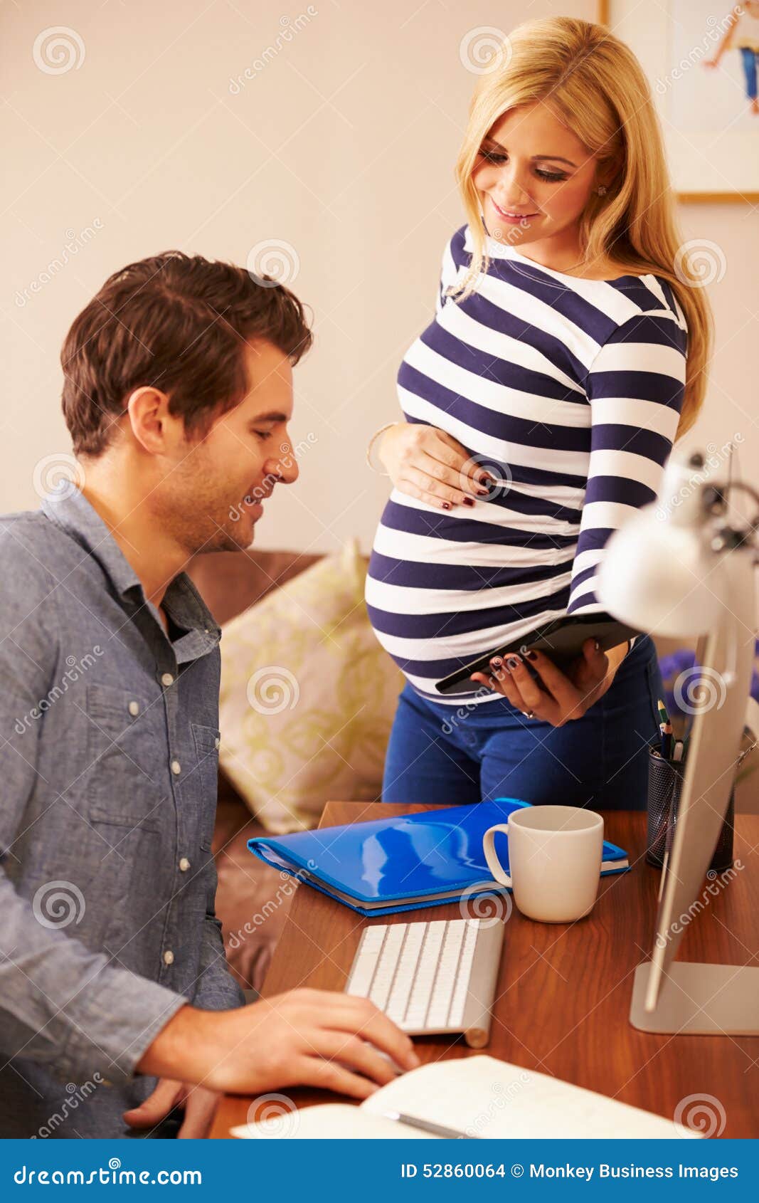Man Sitting at Desk Working at Computer in Home Office Stock Photo ...