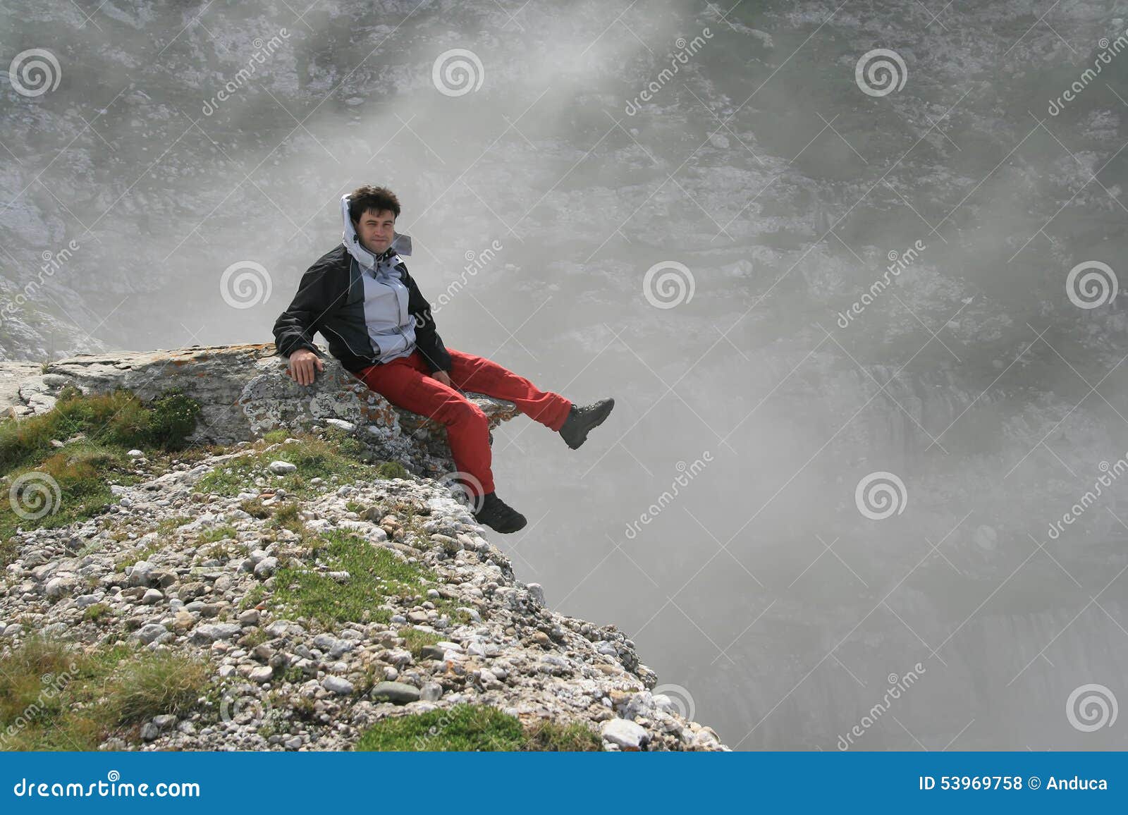 Man sitting on edge stock photo. Image of mountains, precipice - 53969758