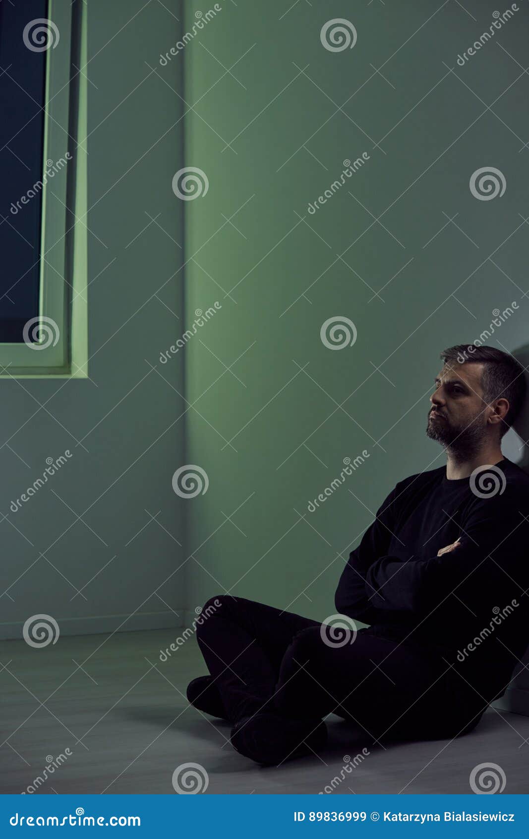 Man sitting in empty room stock image. Image of wall - 89836999
