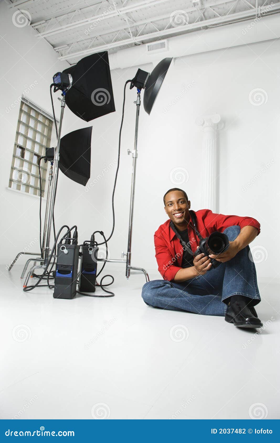 Man Sitting on Floor with Camera. Stock Photo - Image of person ...