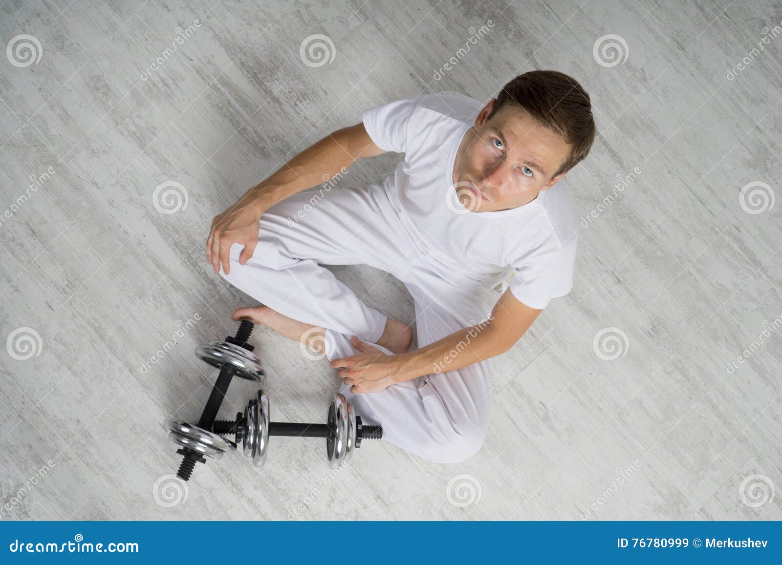 Man Sitting on the Floor with Dumbbells. Resting Time Stock Image ... Man Sitting on the Floor with Dumbbells. Resting Time Stock Image ...